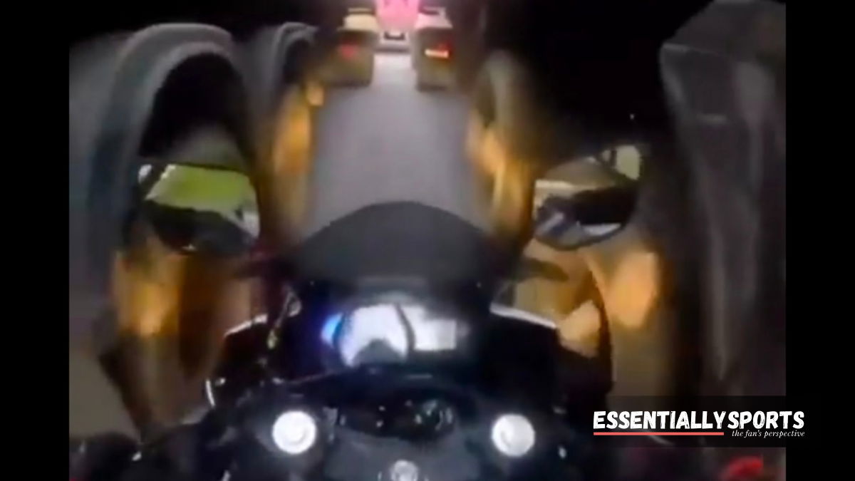 VIDEO: Daredevil Biker's Heart-Stopping Maneuver Between Two Massive ...